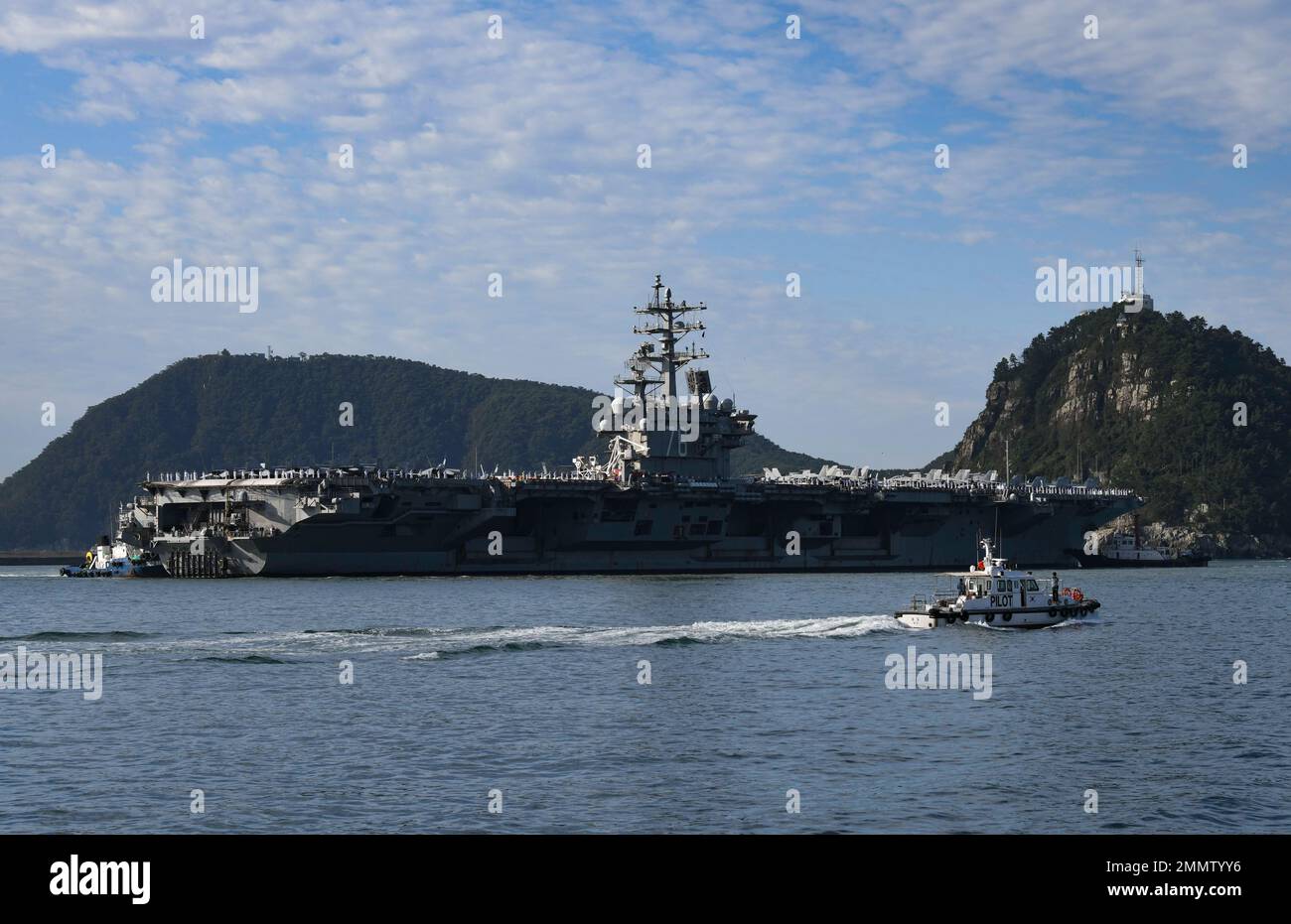 BUSAN, Republic of Korea (Sept. 23, 2022) Tugboats prepare to maneuver ...