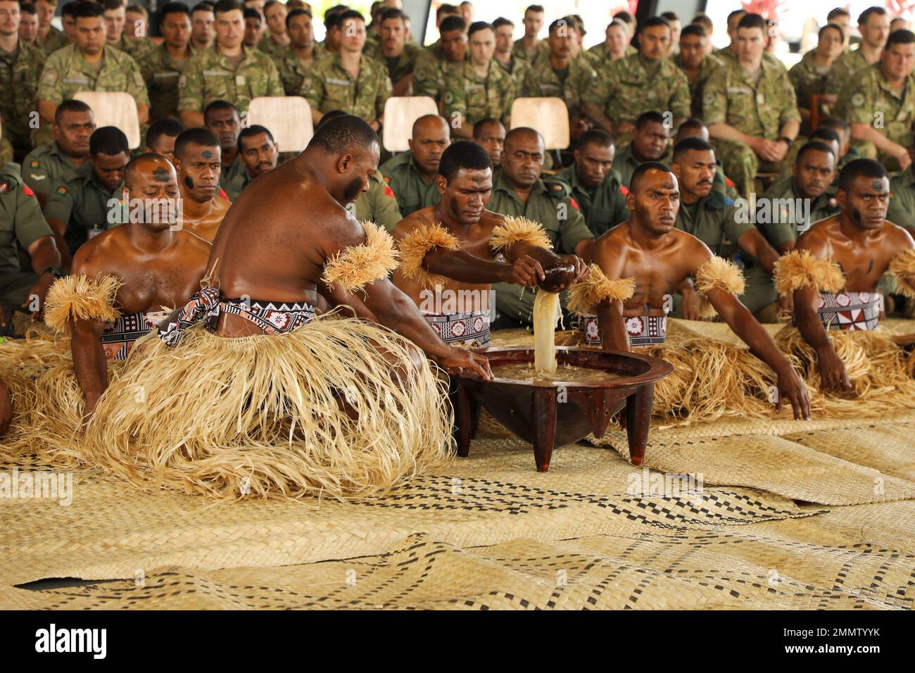 Fijian warriors mix kava during the traditional portion of the closing ...