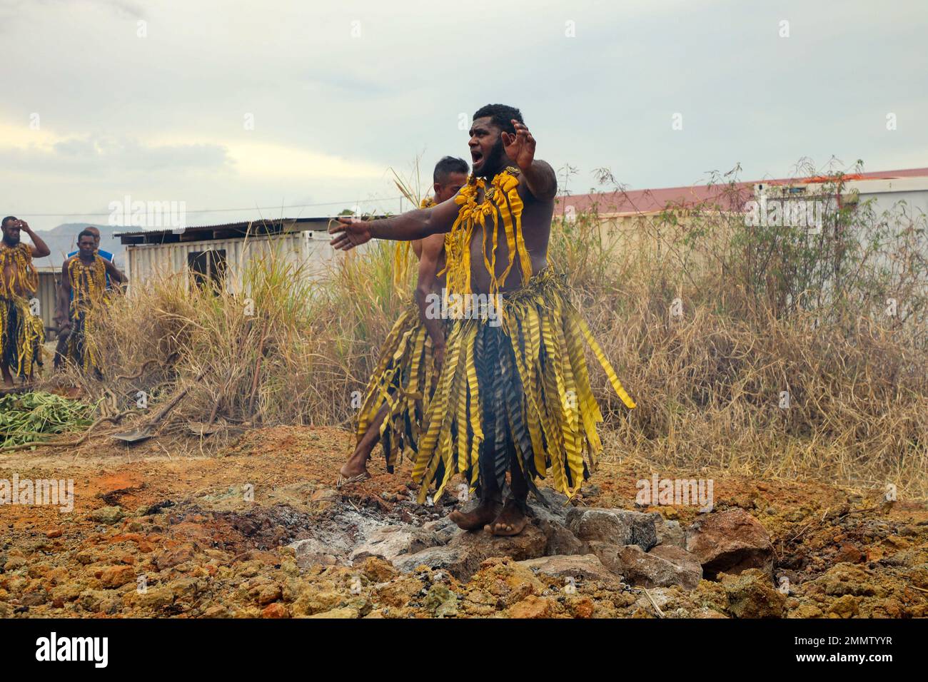 A Fijian firewalker demonstrates his determination during the closing ...