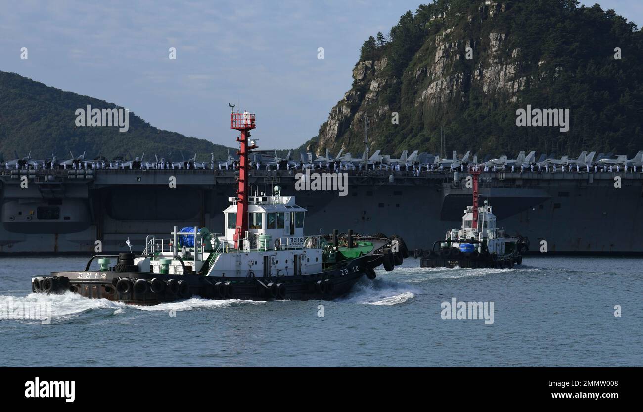 BUSAN, Republic of Korea (Sept. 23, 2022) Tugboats prepare to maneuver ...