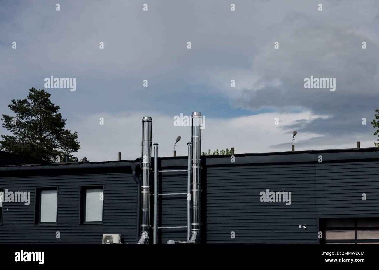 modern factory or warehouse building with steel pipes Stock Photo - Alamy