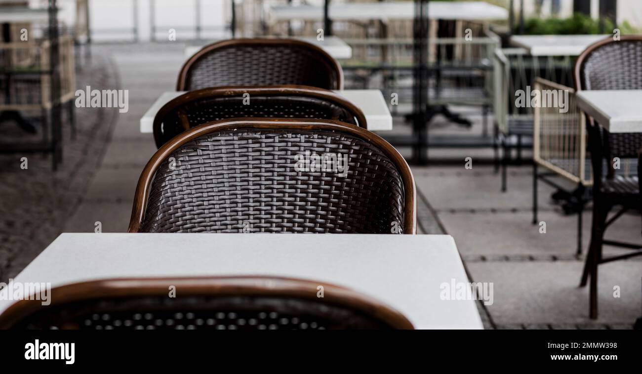 Typical street restaurant. european street terrace. Empty Cafe tables ...