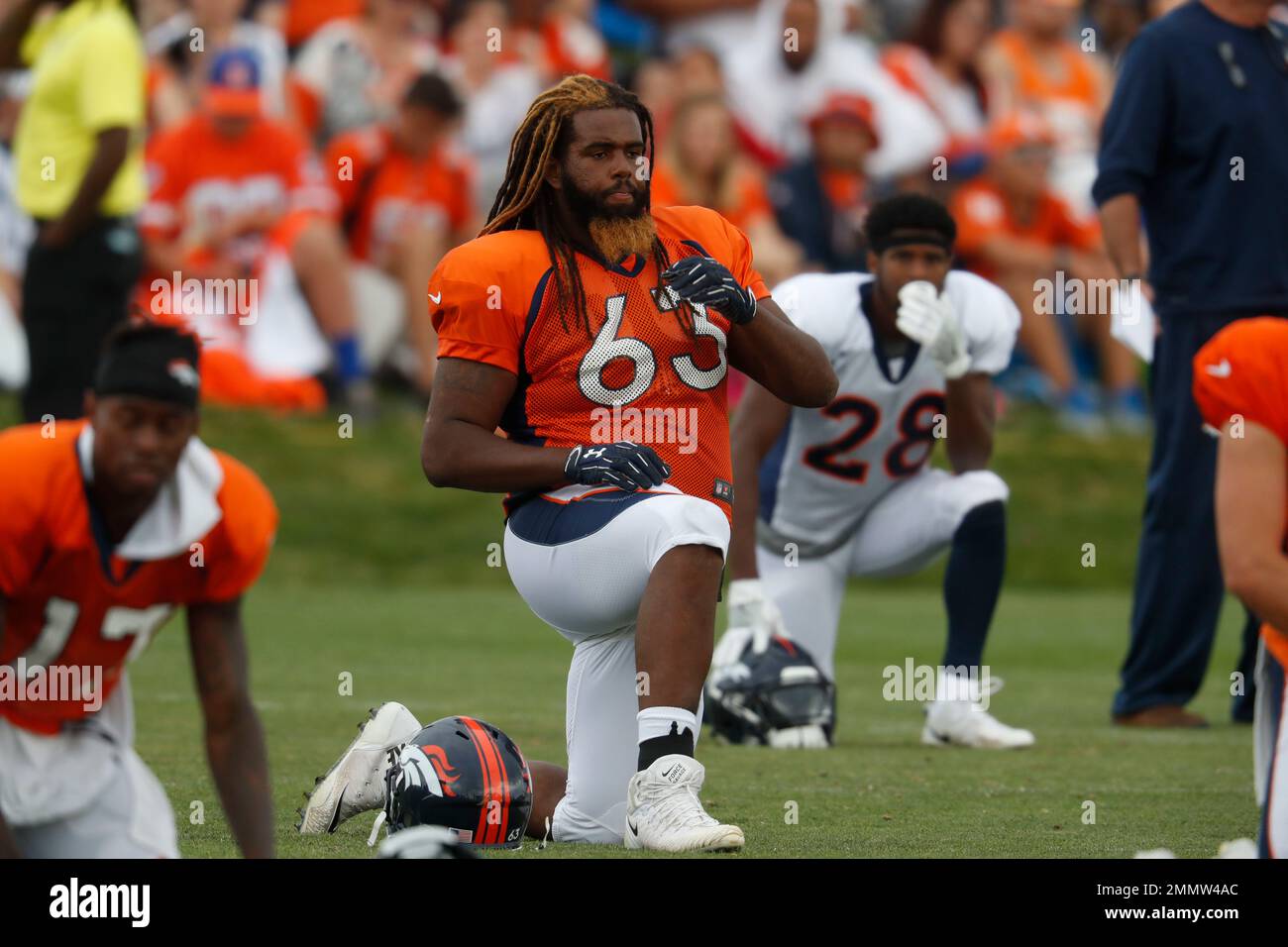 Denver Broncos offensive tackle Leon Johnson (63) takes part in drills ...