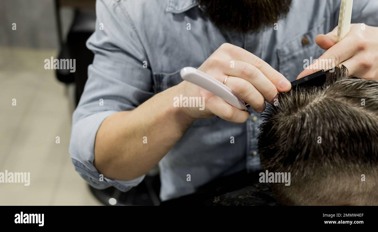 Male client getting haircut hairdresser hi-res stock photography and ...