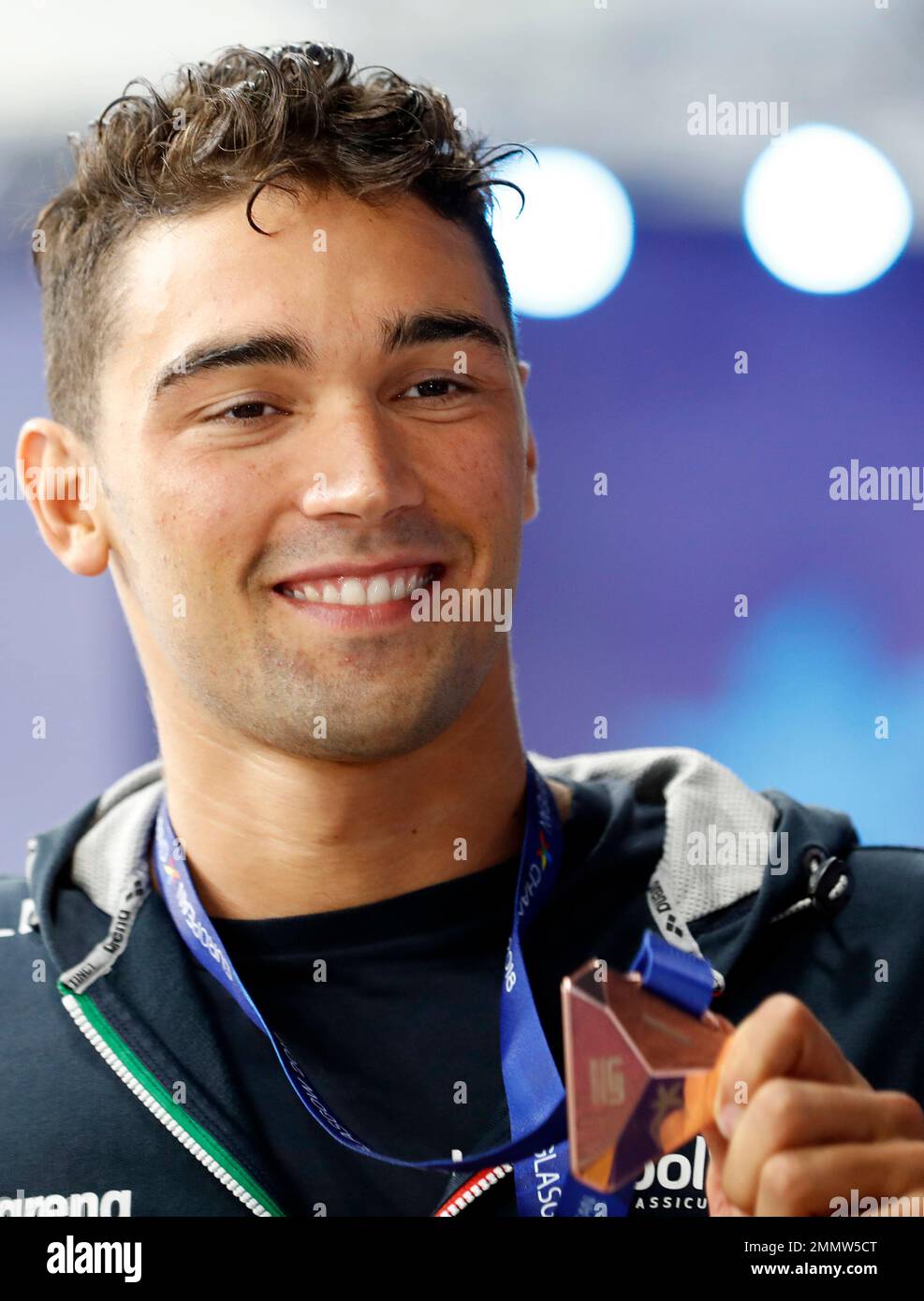Luca Pizzini of Italy poses with his bronze medal after the 200 meters ...
