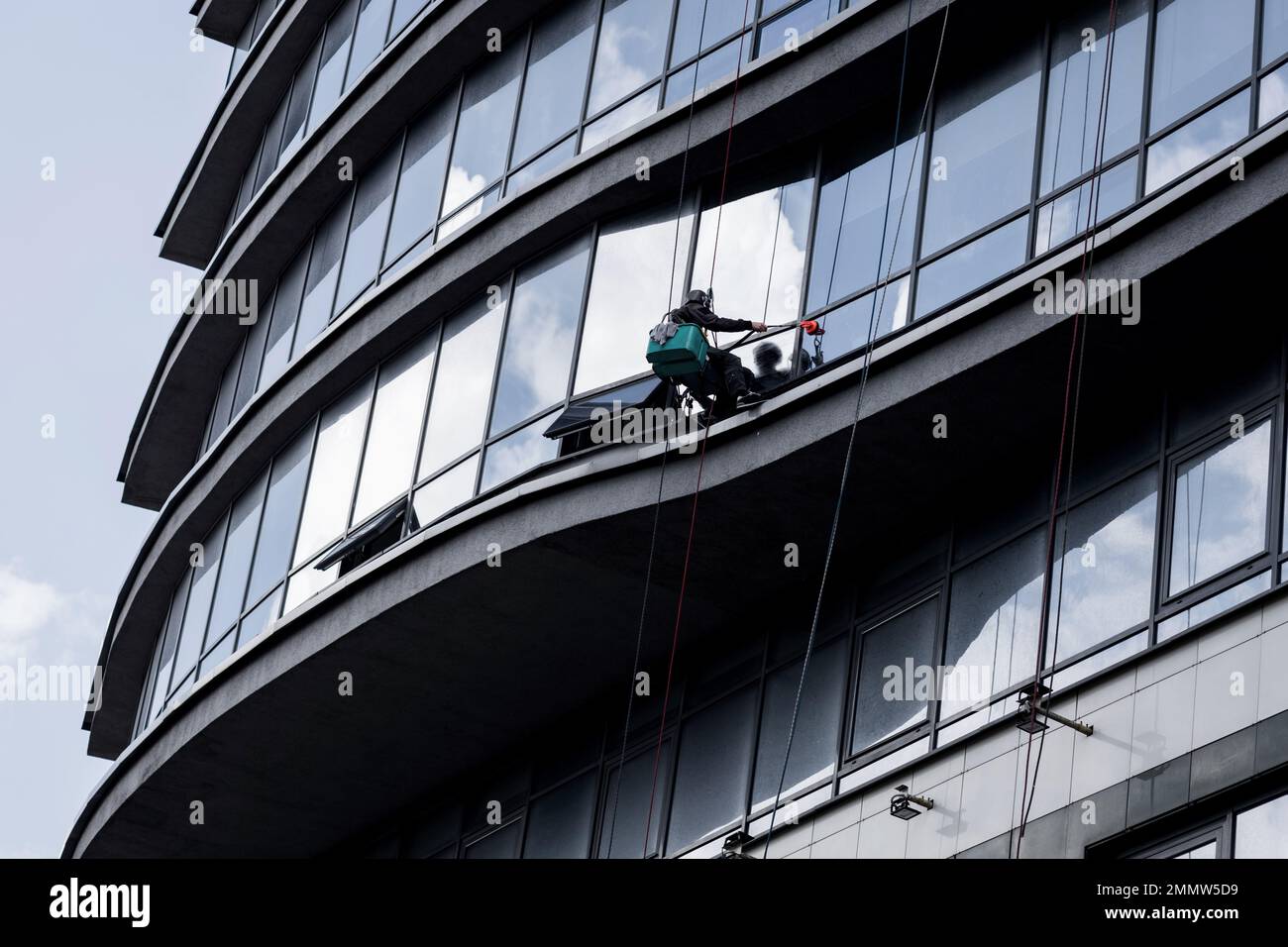 extreme work at height. Window Washers on a Office Building Stock Photo ...