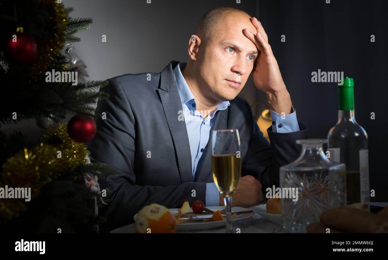 Tired man celebrating New Year Stock Photo - Alamy