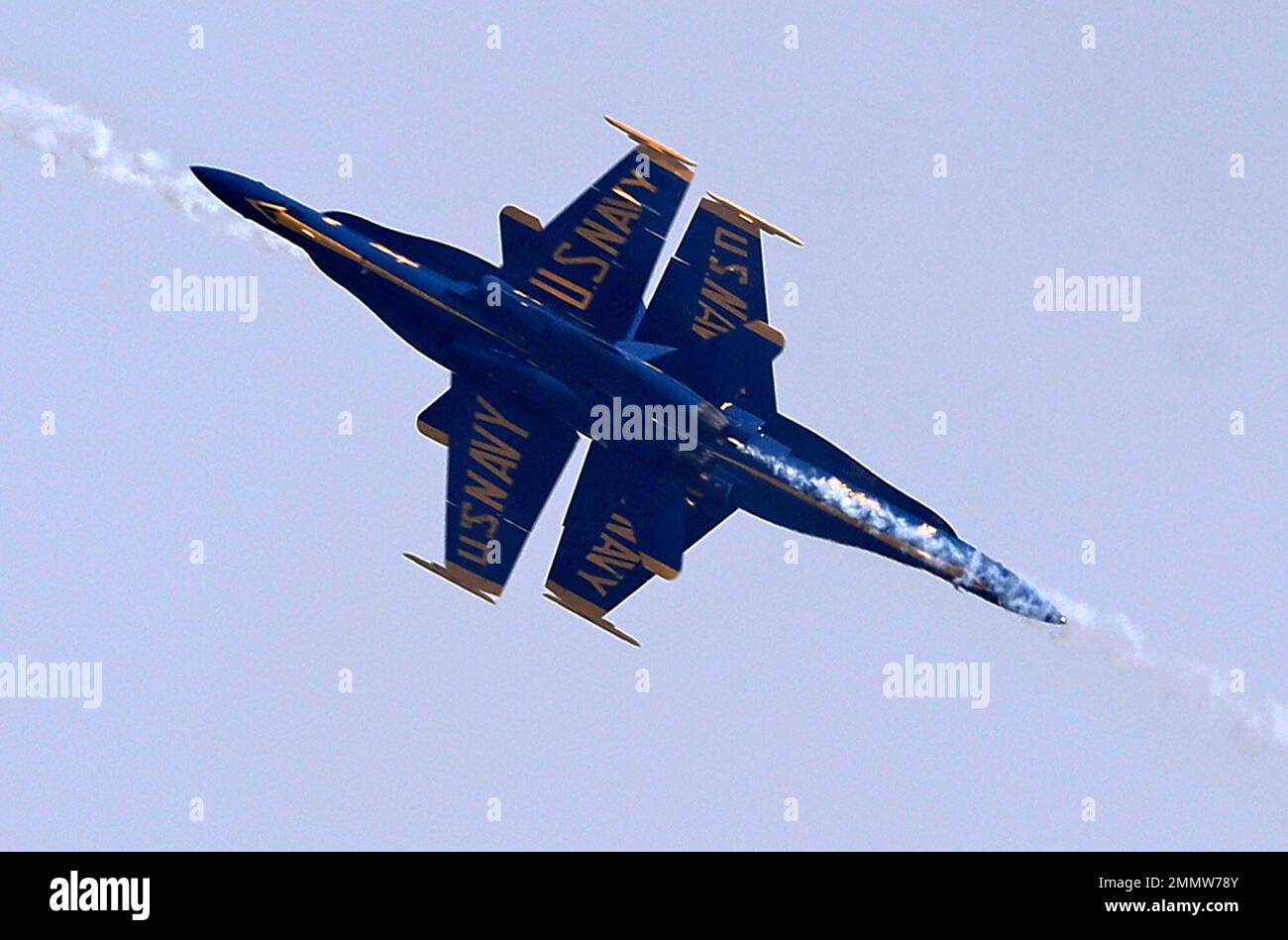 Two members of the U.S. Navy Blue Angels make a close pass as they ...
