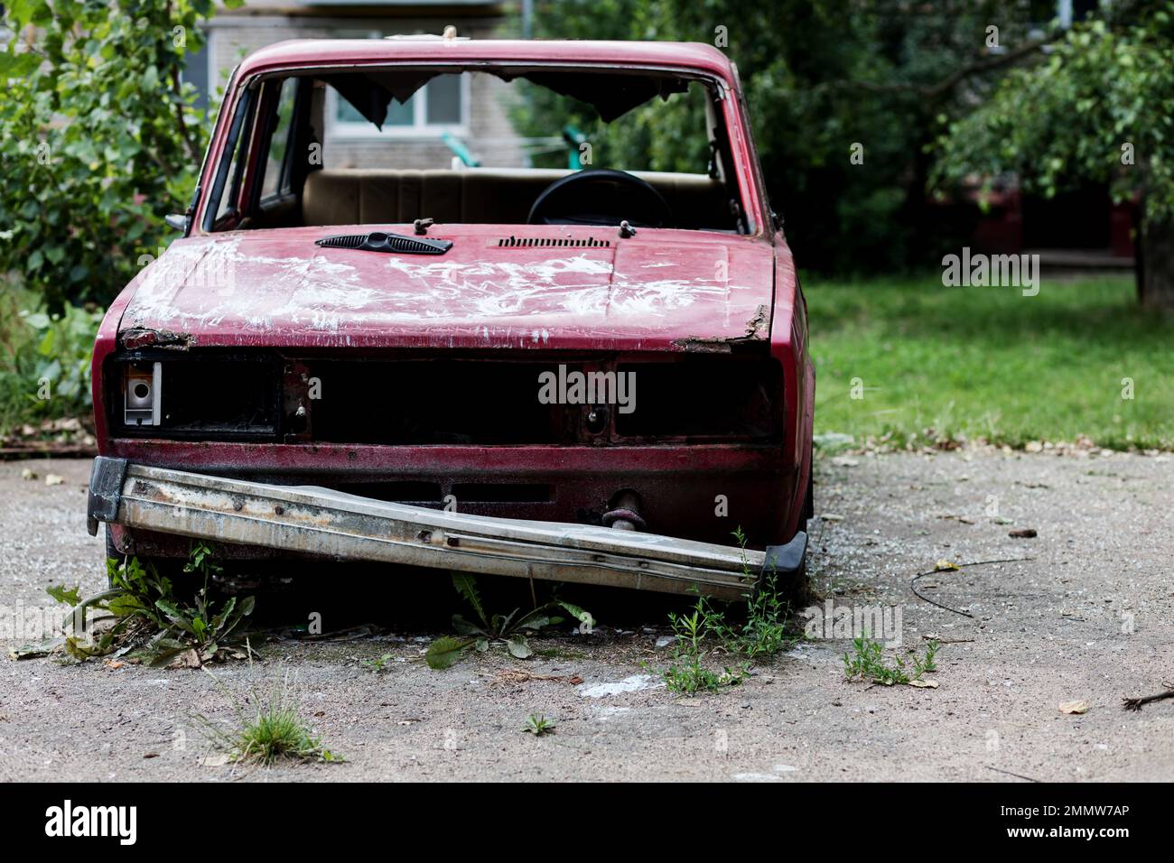 Disassembled abandoned car. Wreck of the car in the bushes. Abandoned ...