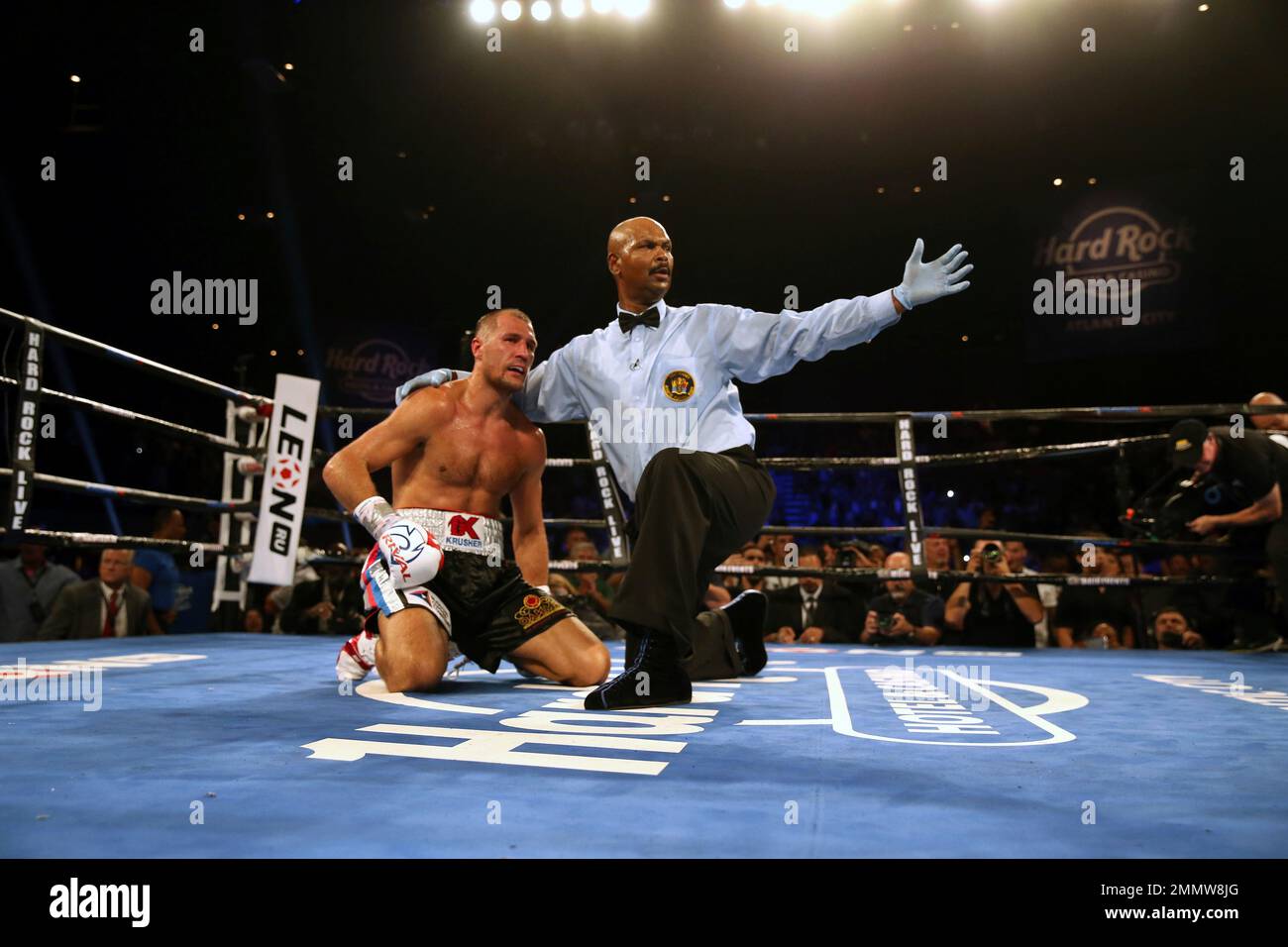 Referee David Fields, right, summons medical attendants after Sergey ...