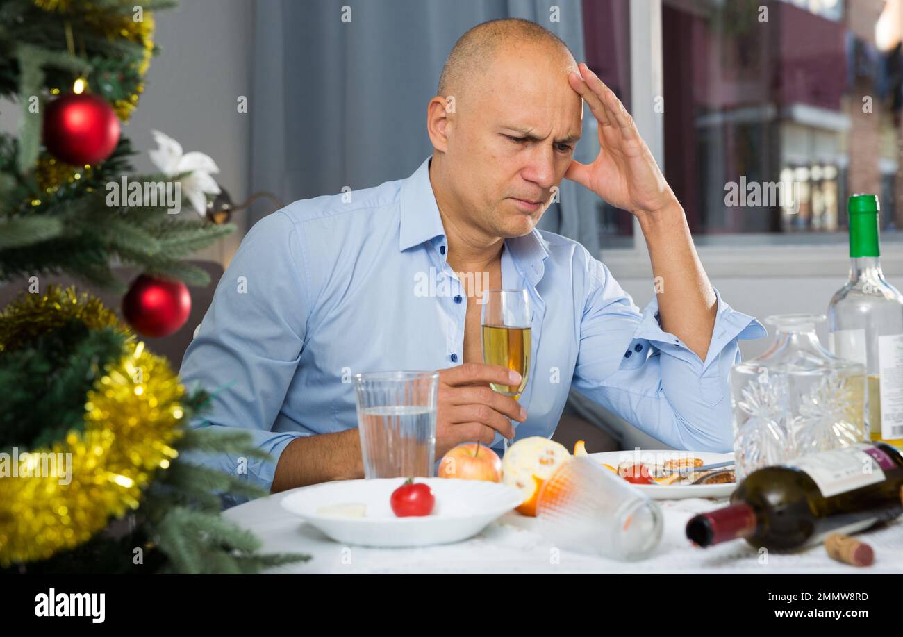 Sad man sit table alone hi-res stock photography and images - Alamy