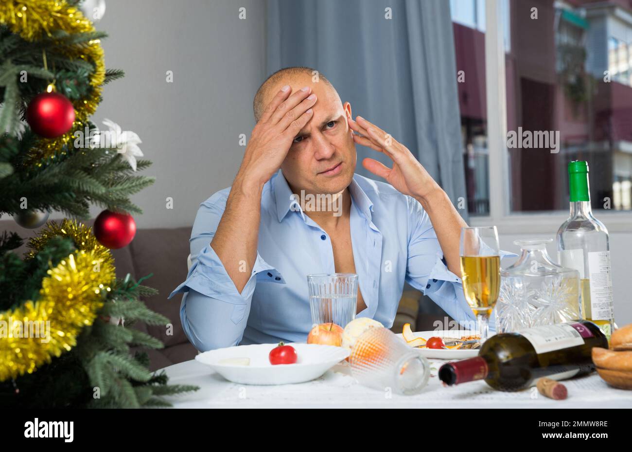 Sad man sit table alone hi-res stock photography and images - Alamy