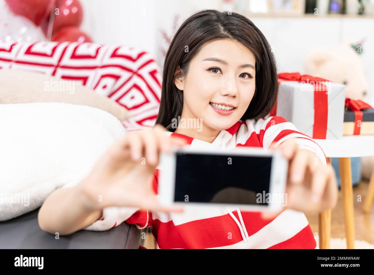 Young women use tablet phone at home Stock Photo - Alamy
