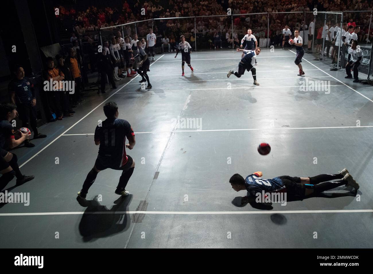 A Malaysian player dives to duck the ball thrown by Team USA during men ...
