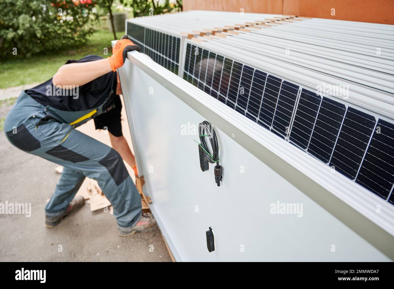 Worker taking solar panel for carrying and installing. Renewable and ...