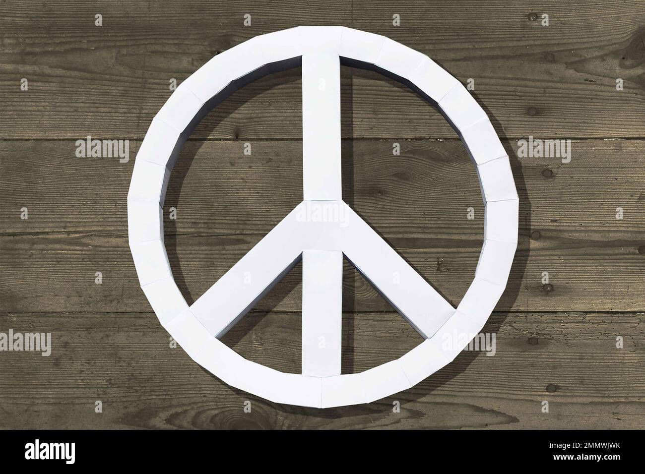 Paper Peace sign on a wood background, papercraft Stock Photo - Alamy