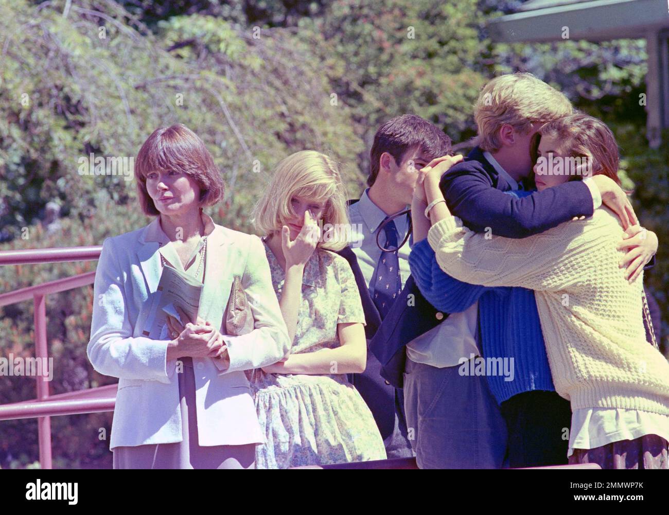 Mourners hug and wipe away tears after a memorial service for Erin O ...