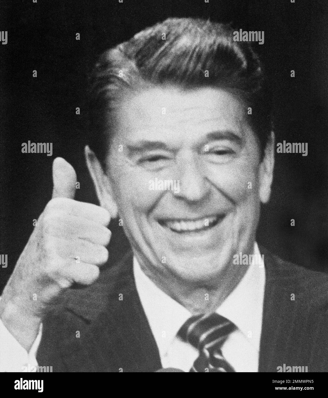 President Ronald Reagan smiles broadly from the podium of Century Plaza ...
