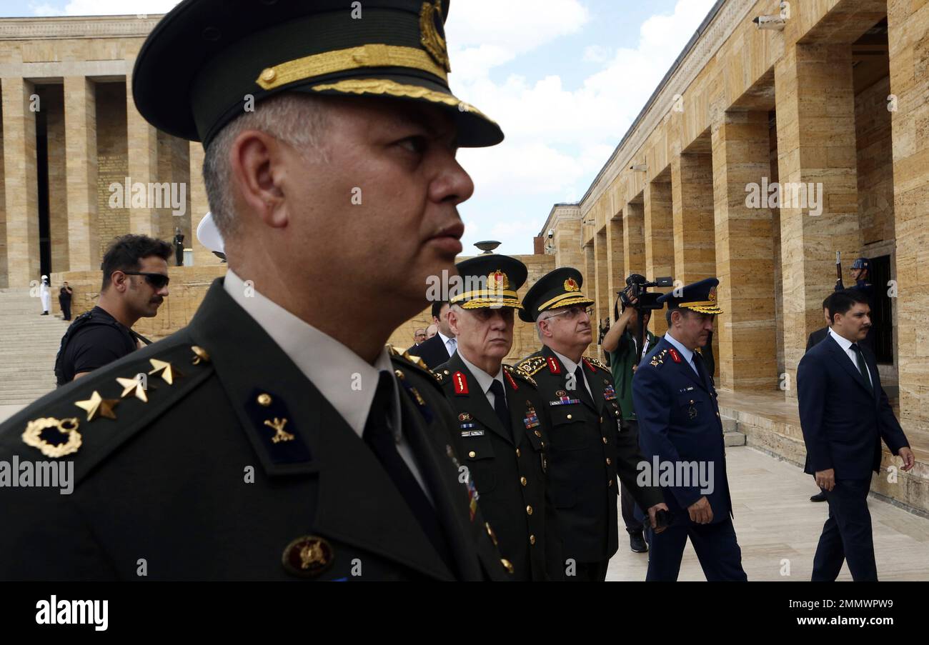 Turkish army commanders follow President Recep Tayyip Erdogan during a ...