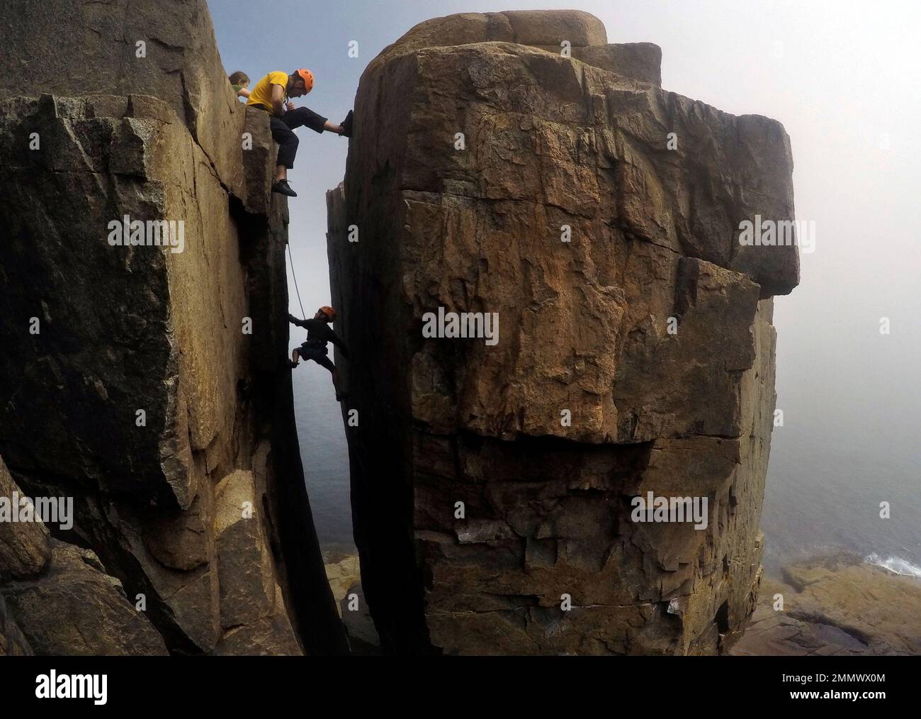 Jacob Coombs, 10, of Kent, England, makes his way up The Great Chimney ...