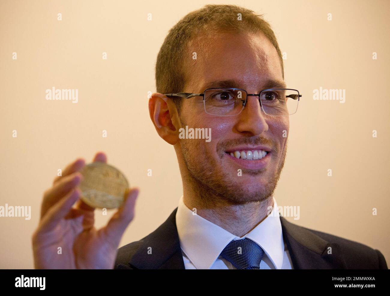 Italian Alessio Figalli shows his medal during a press conference ...
