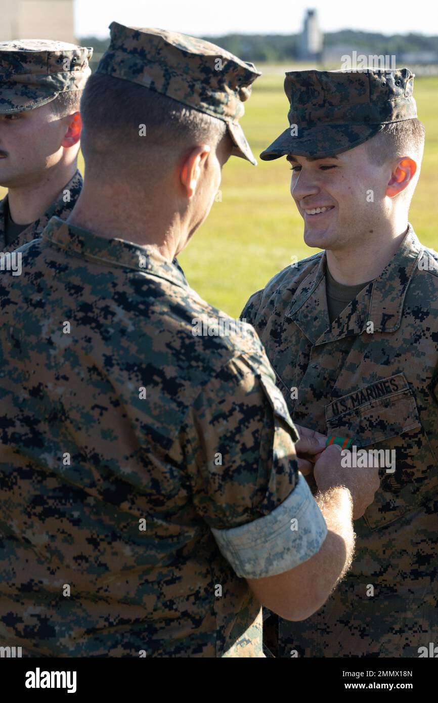 U.S. Marine Corps Lance Cpl. Austin Powell, right, military police ...