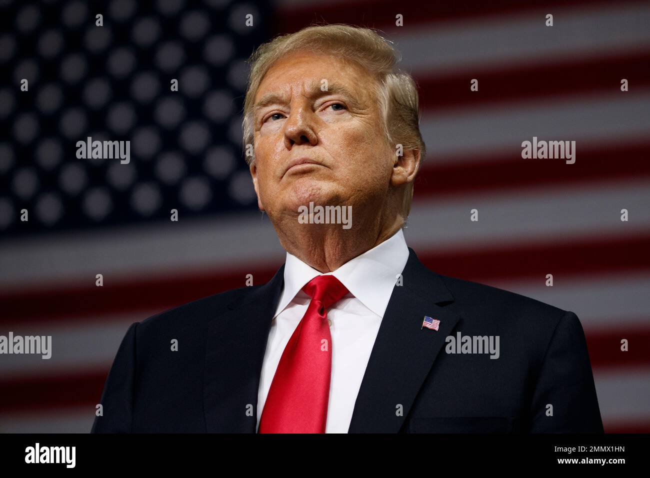 President Donald Trump listens during a campaign rally at Florida State ...