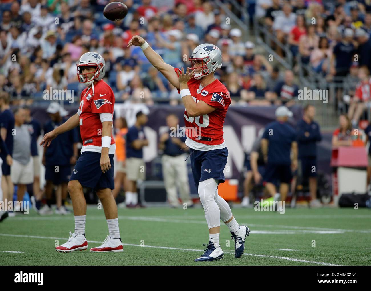 New England Patriots quarterback Danny Etling delivers a pass as ...