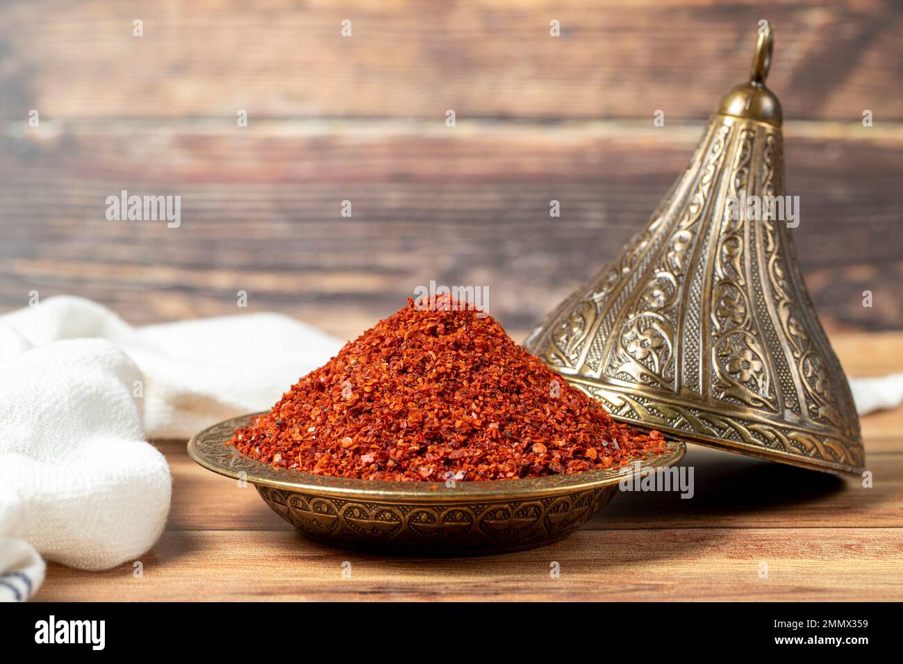 Red pepper flakes. Crushed chili pepper in bowl, dried chili flakes on ...