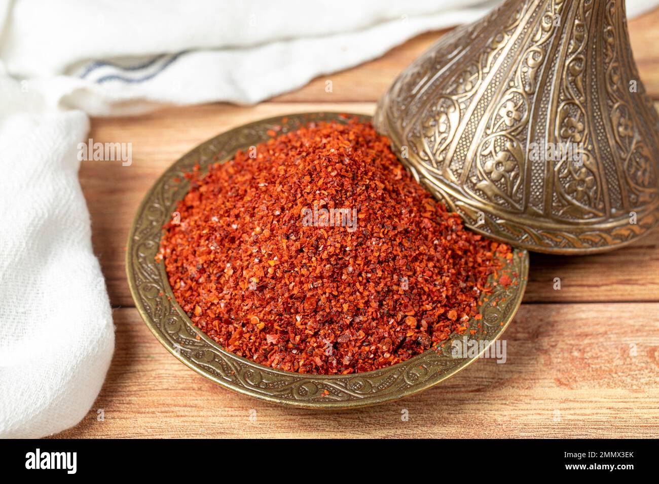 Red pepper flakes. Crushed chili pepper in bowl, dried chili flakes on ...