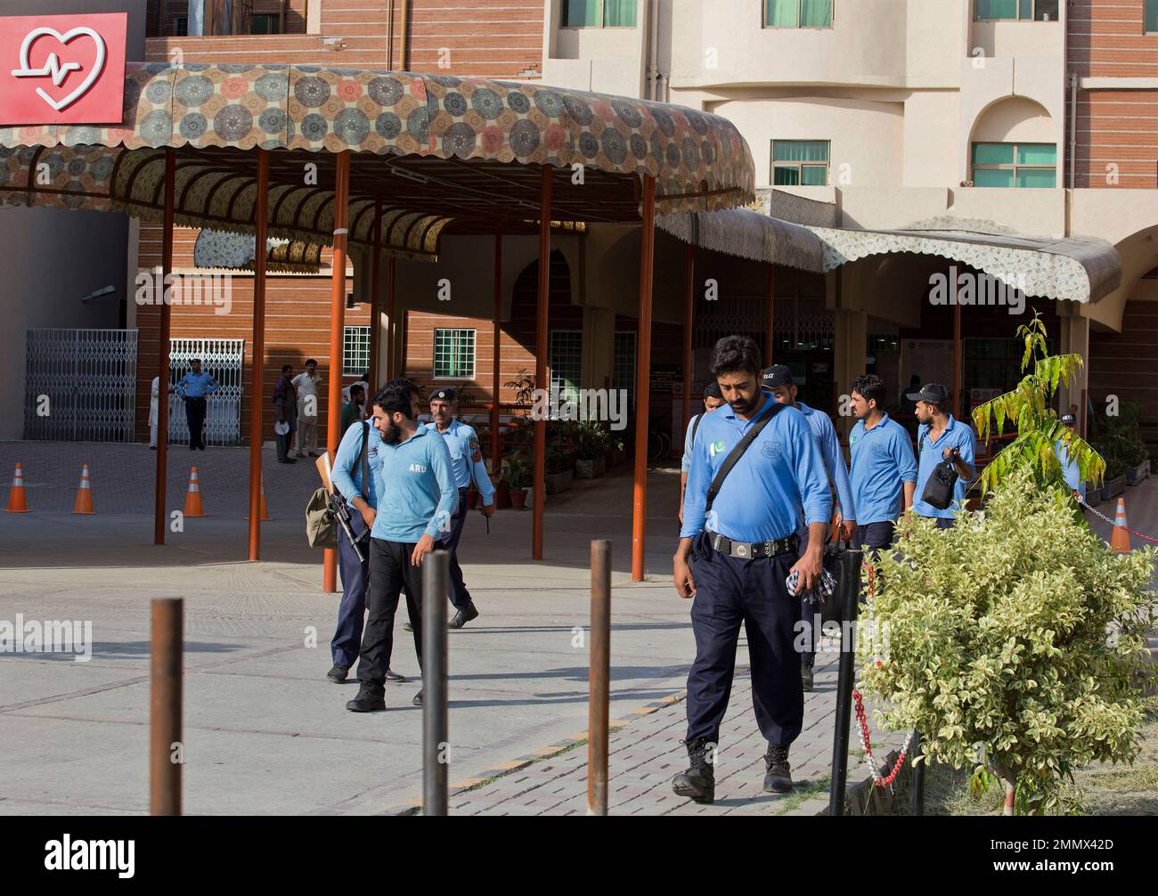 Pakistani police officers guard the cardiac ward, where jailed former ...