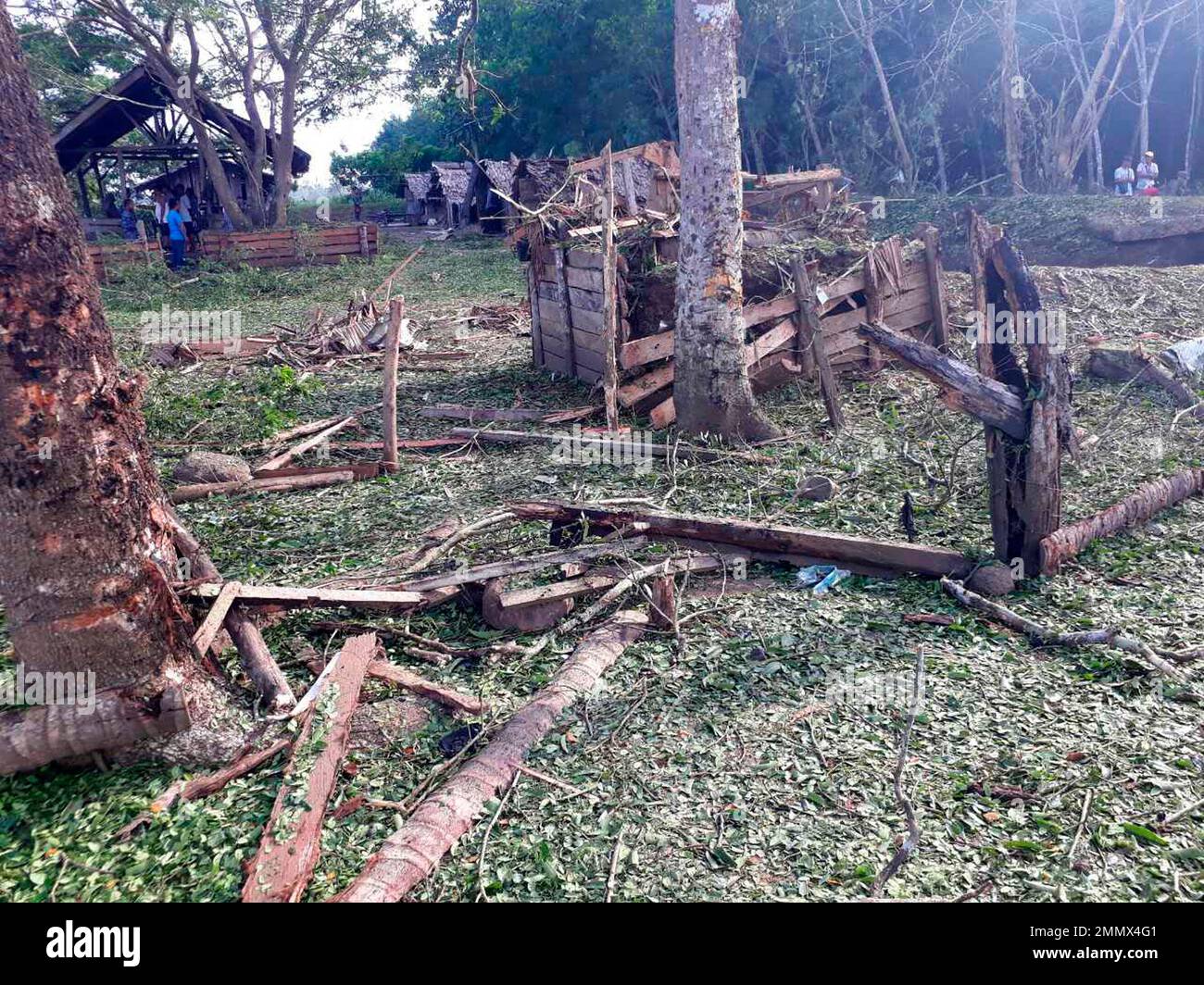 Government forces inspect a damaged military outpost after a bomb ...
