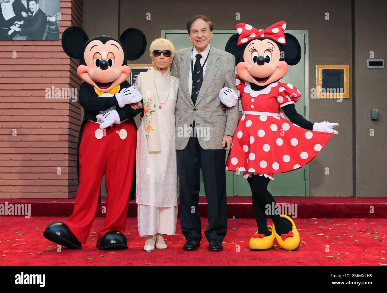 Mickey Mouse, from left, Elizabeth Gluck, Richard M. Sherman and Minnie ...