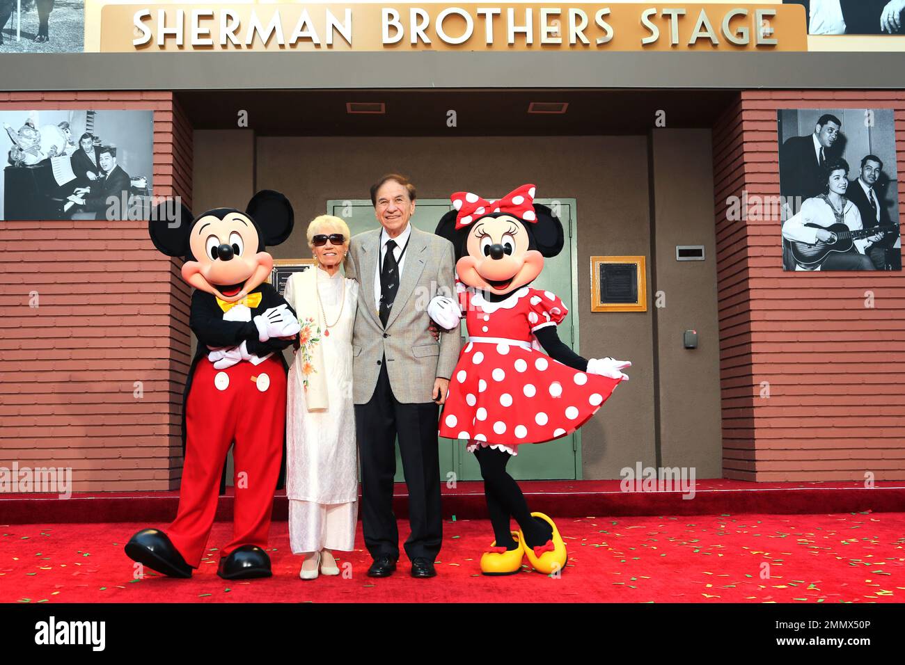 Mickey Mouse, from left, Elizabeth Gluck, Richard M. Sherman and Minnie ...