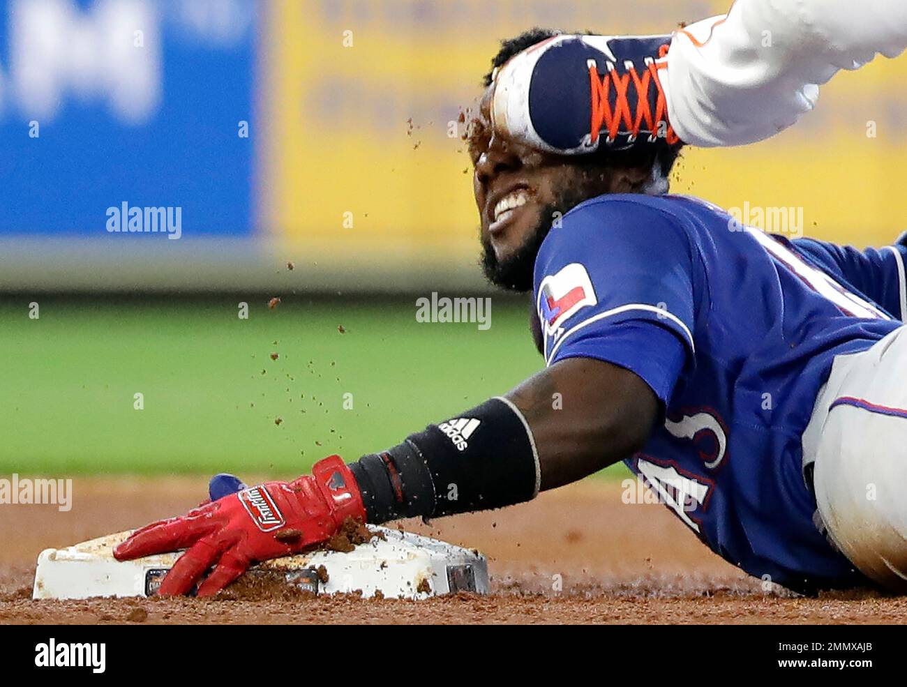 Houston Astros second baseman Yuli Gurriel steps on the face of Texas ...