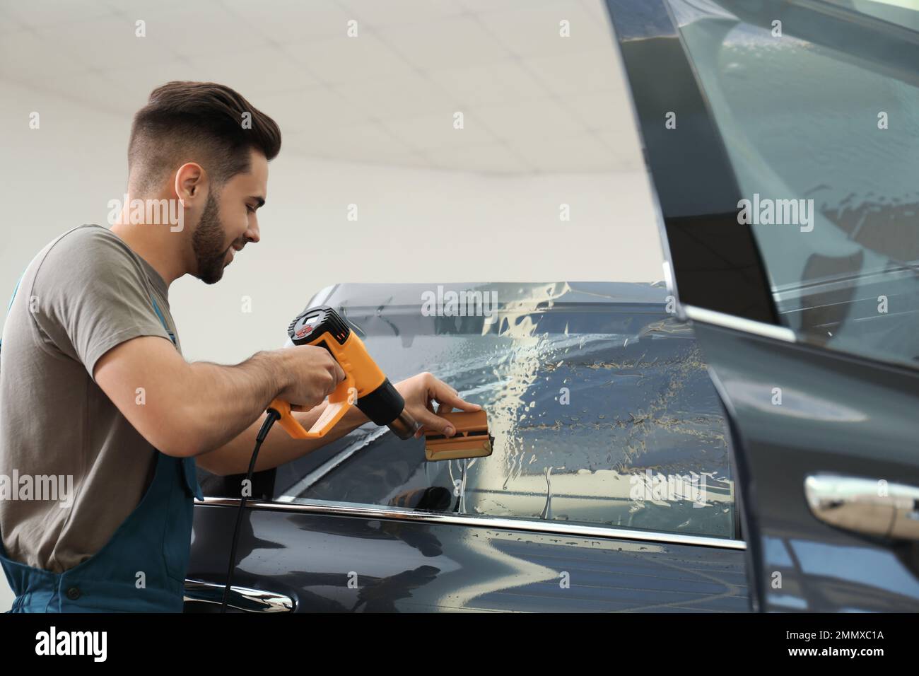 Heat gun window tinting hi-res stock photography and images - Alamy