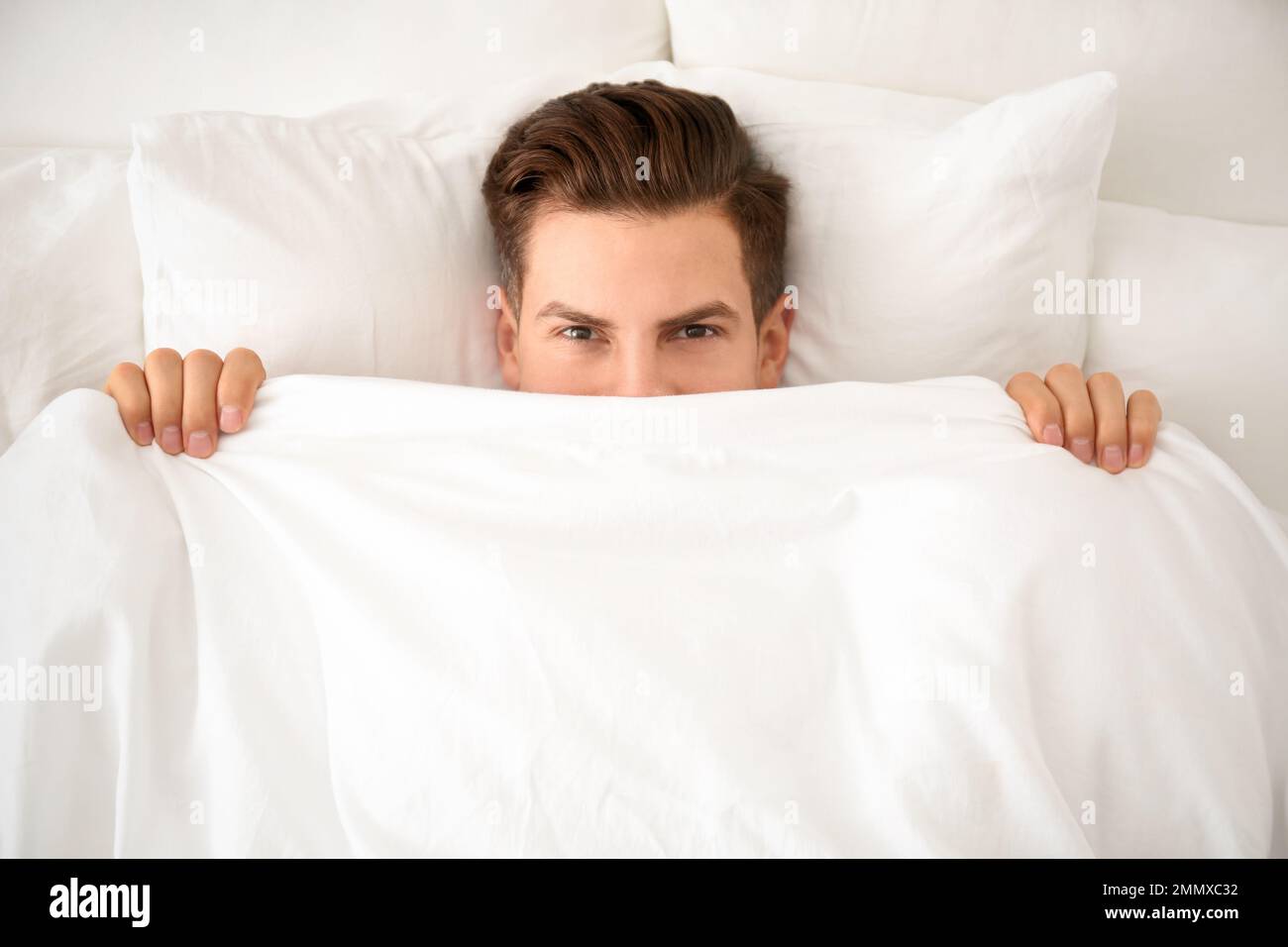 Man under blanket hi-res stock photography and images - Alamy