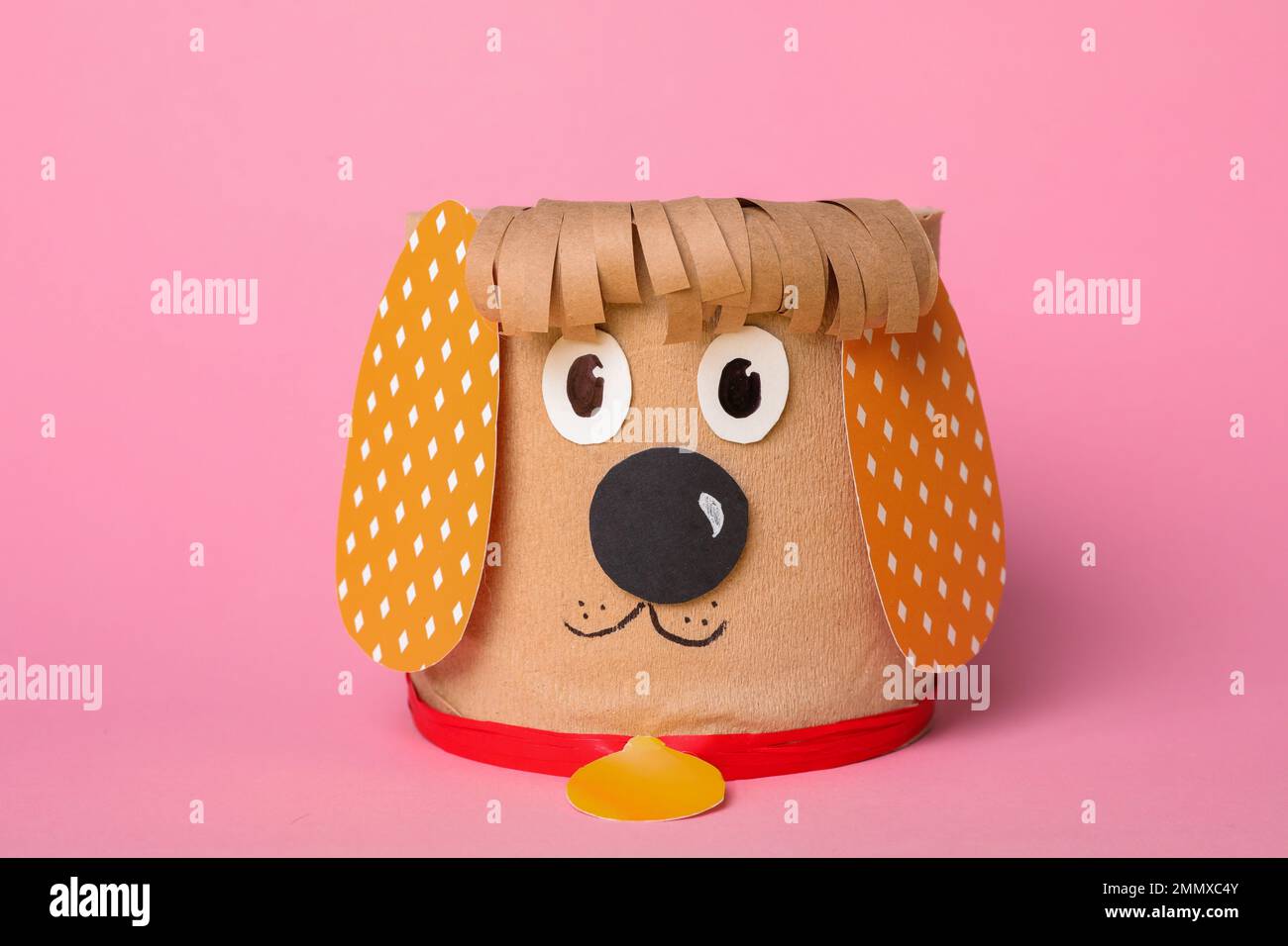 Toy dog made of toilet paper roll on pink background Stock Photo - Alamy