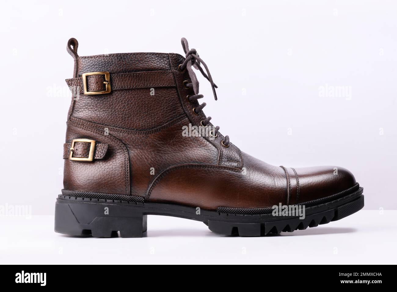 Side view of a brown colored leather boot on a white background Stock ...