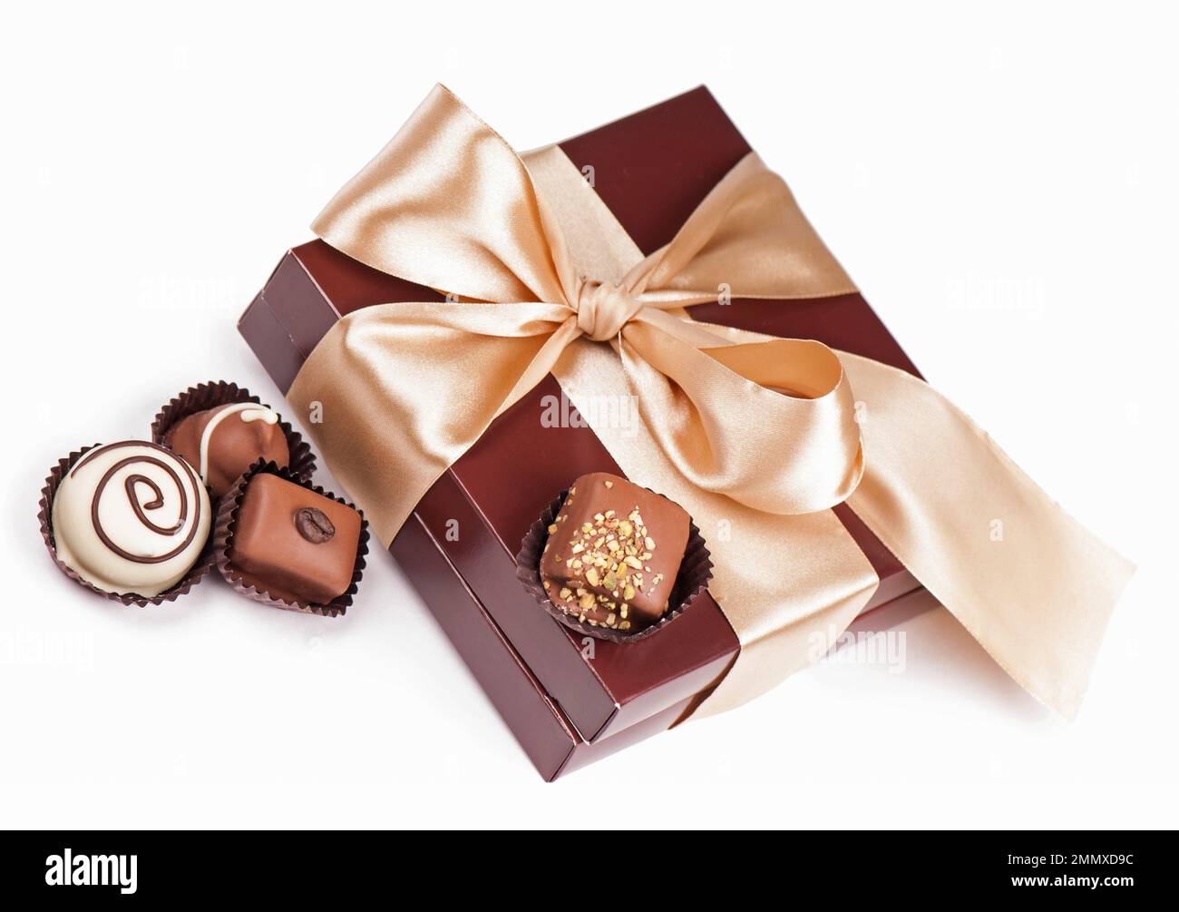 brown box with candies and golden tape on a white background Stock ...