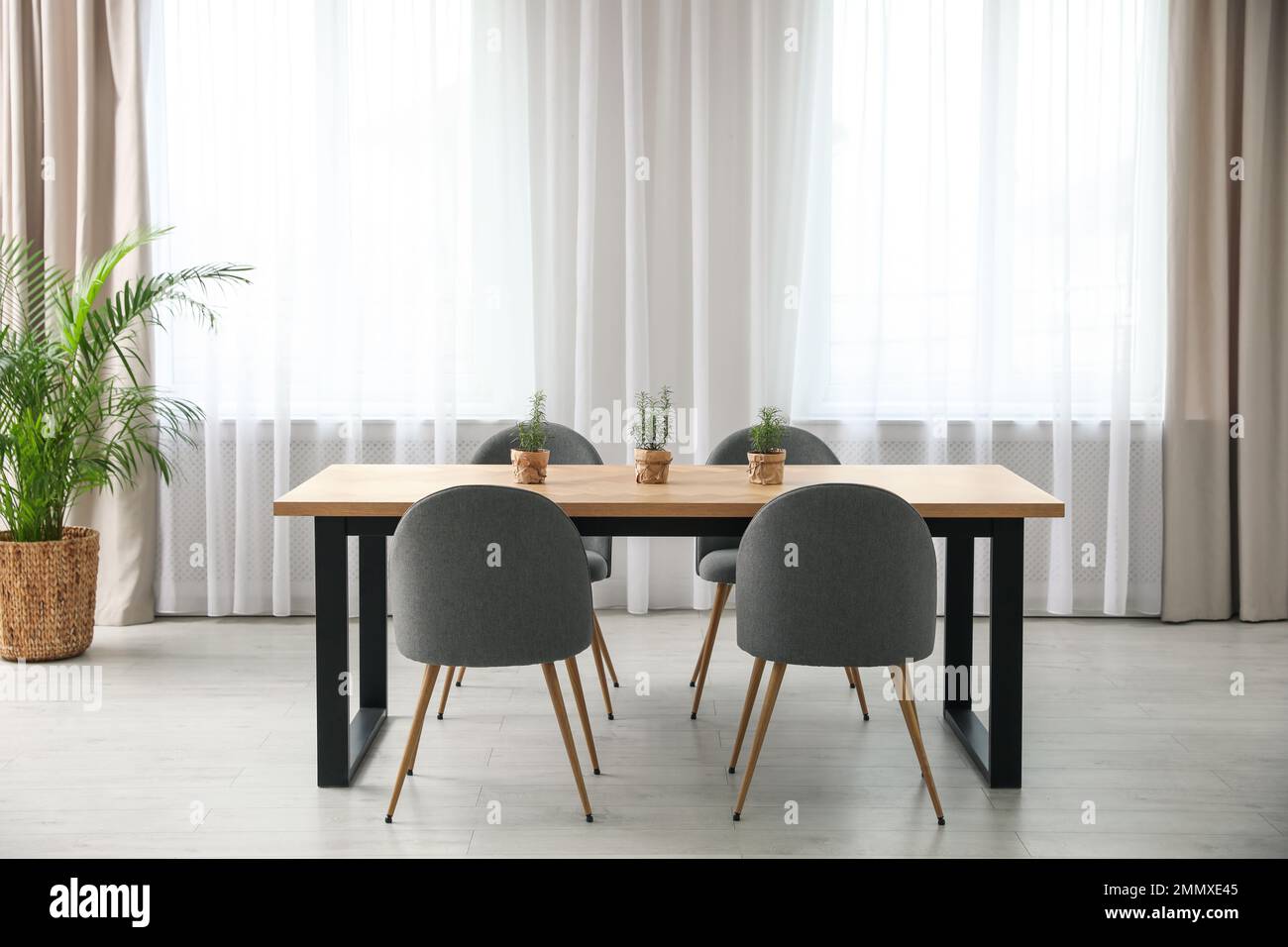 Modern room interior with chairs and table Stock Photo - Alamy