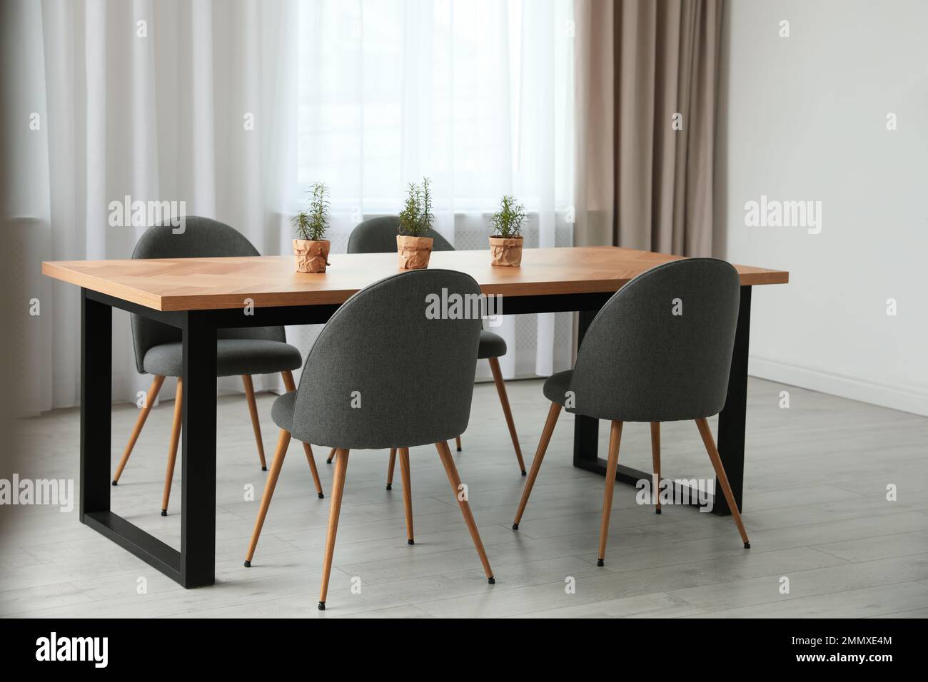 Modern room interior with chairs and table Stock Photo - Alamy