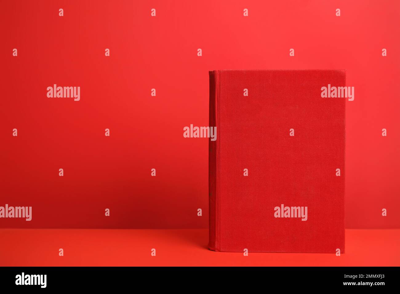 Hardcover book on red background. Space for design Stock Photo - Alamy