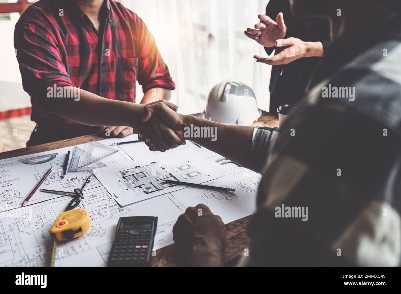 Close up of Architect team working with house model for architectural ...