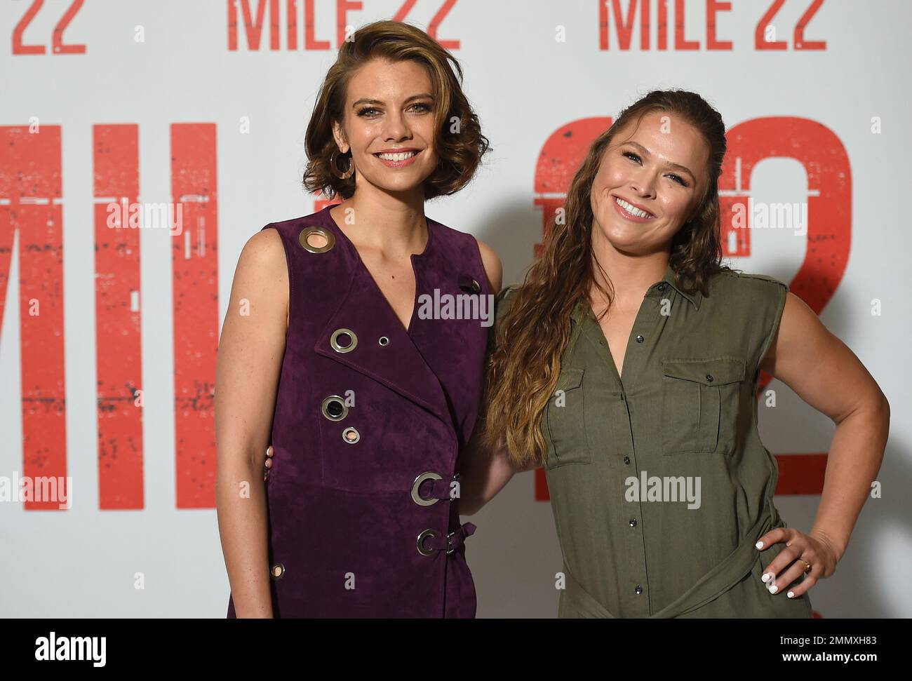 Cast members Lauren Cohan, left, and Ronda Rousey attend a "Mile 22 ...