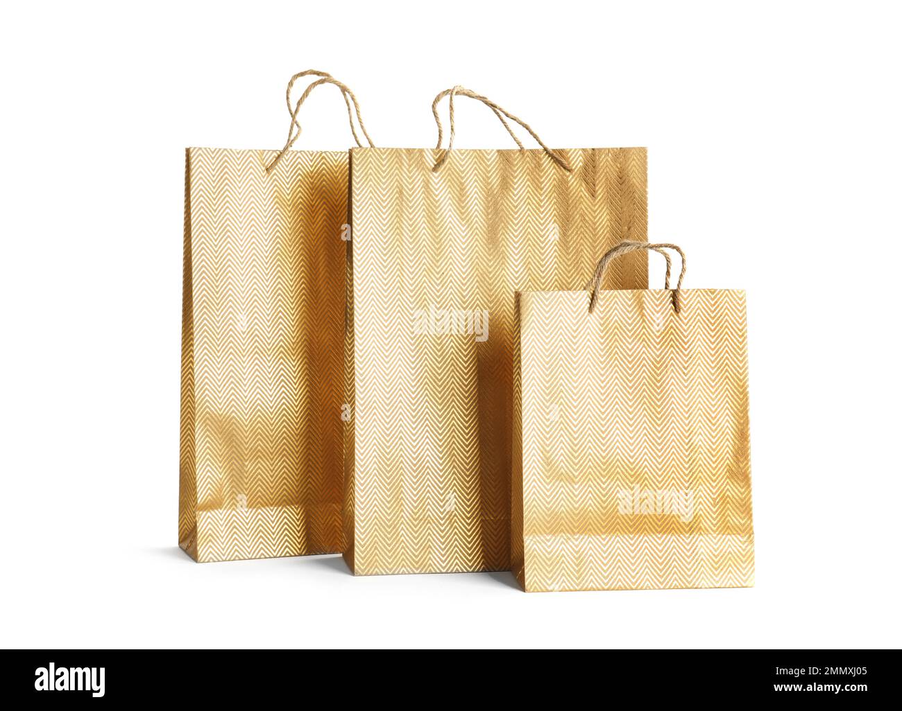 Golden paper shopping bags isolated on white. Space for design Stock ...