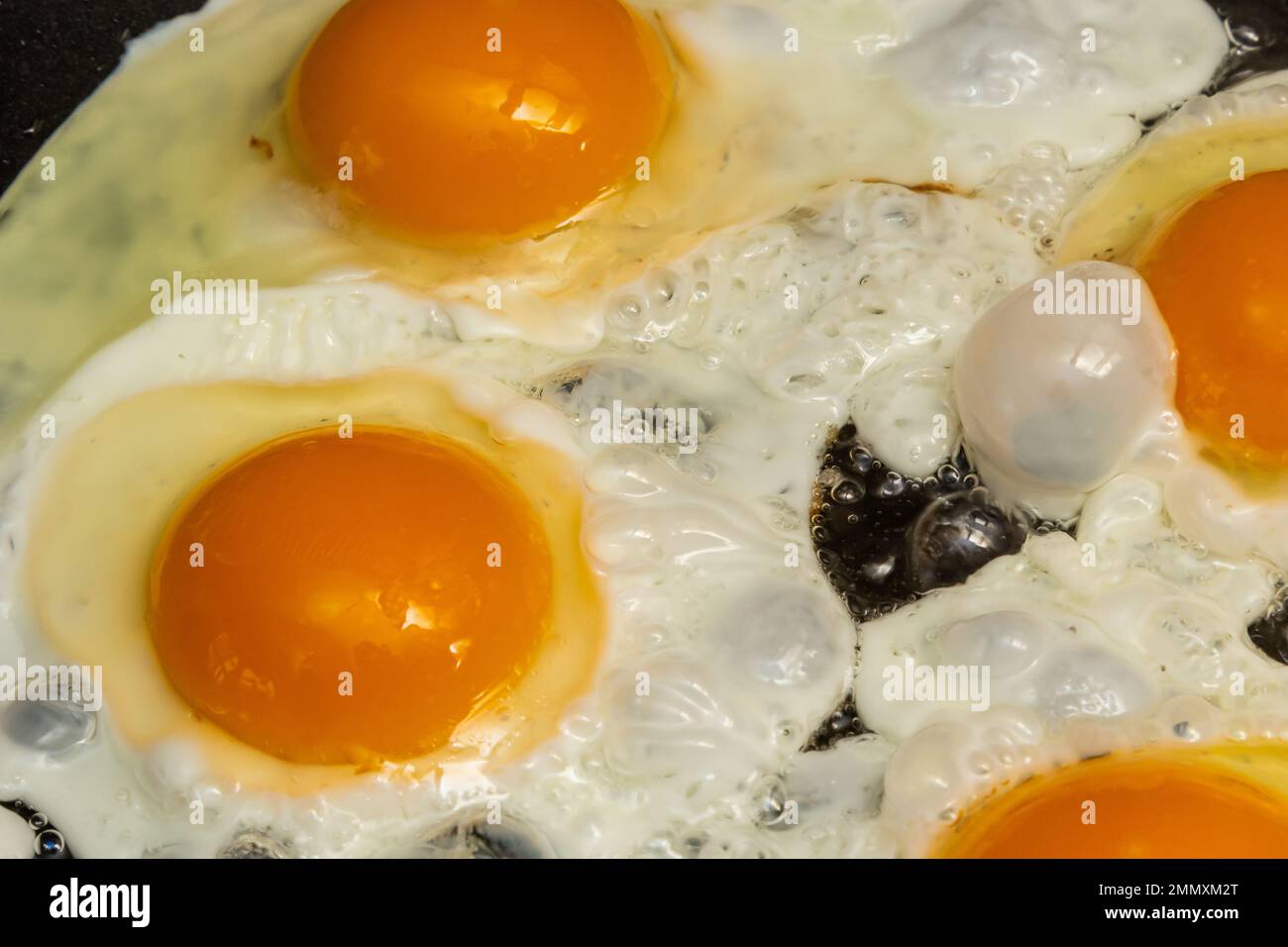 the process of preparing eggs for morning breakfast Stock Photo - Alamy