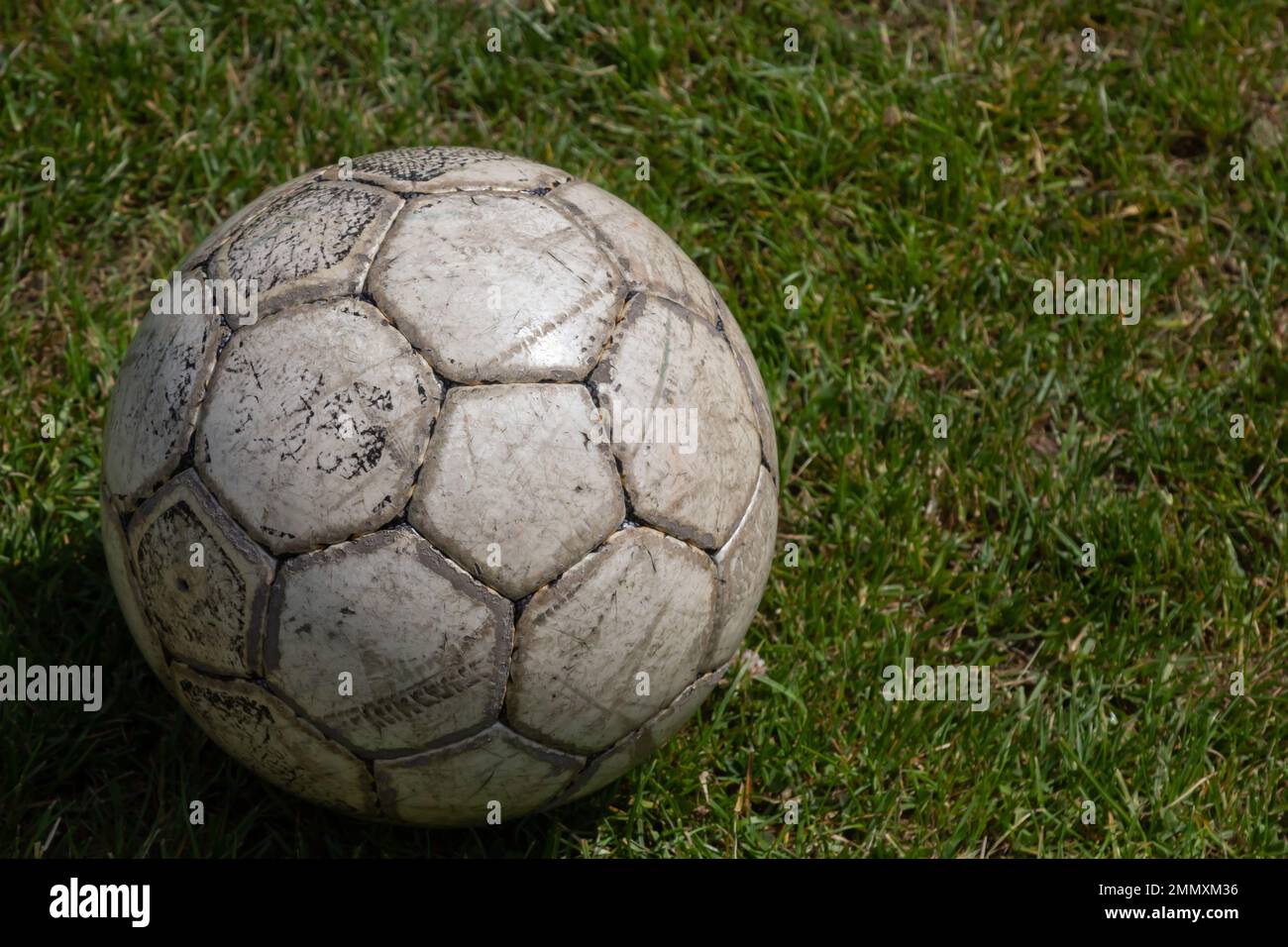 Round soccer ball on grass hi-res stock photography and images - Alamy