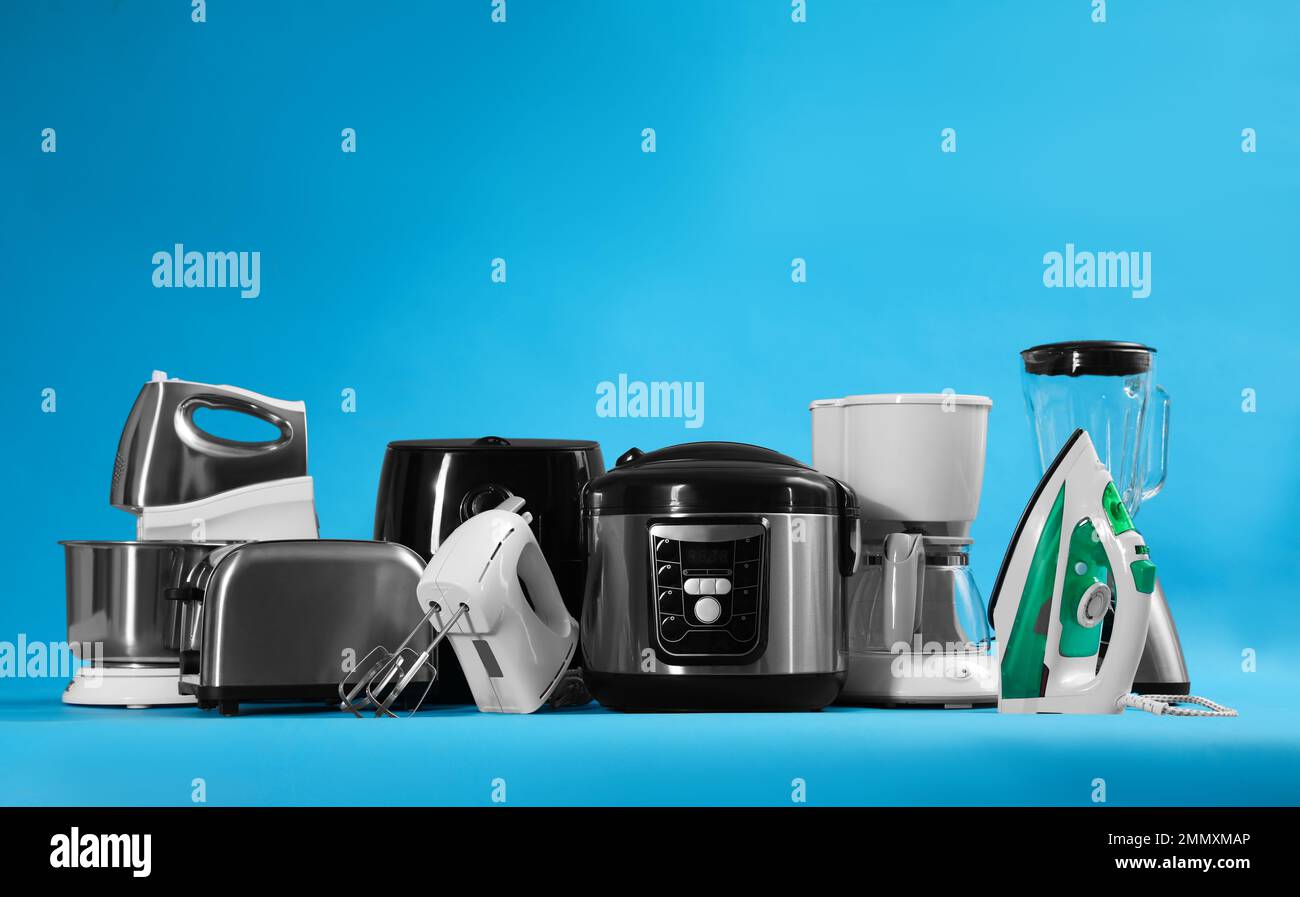 Set of different household appliances on light blue background Stock ...