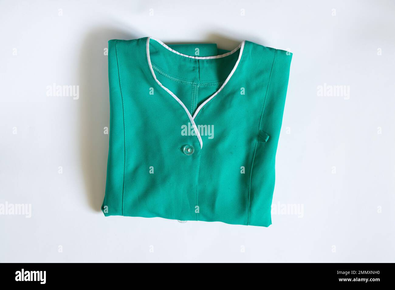 an old doctor's medical suit lies on a white background, a medical ...